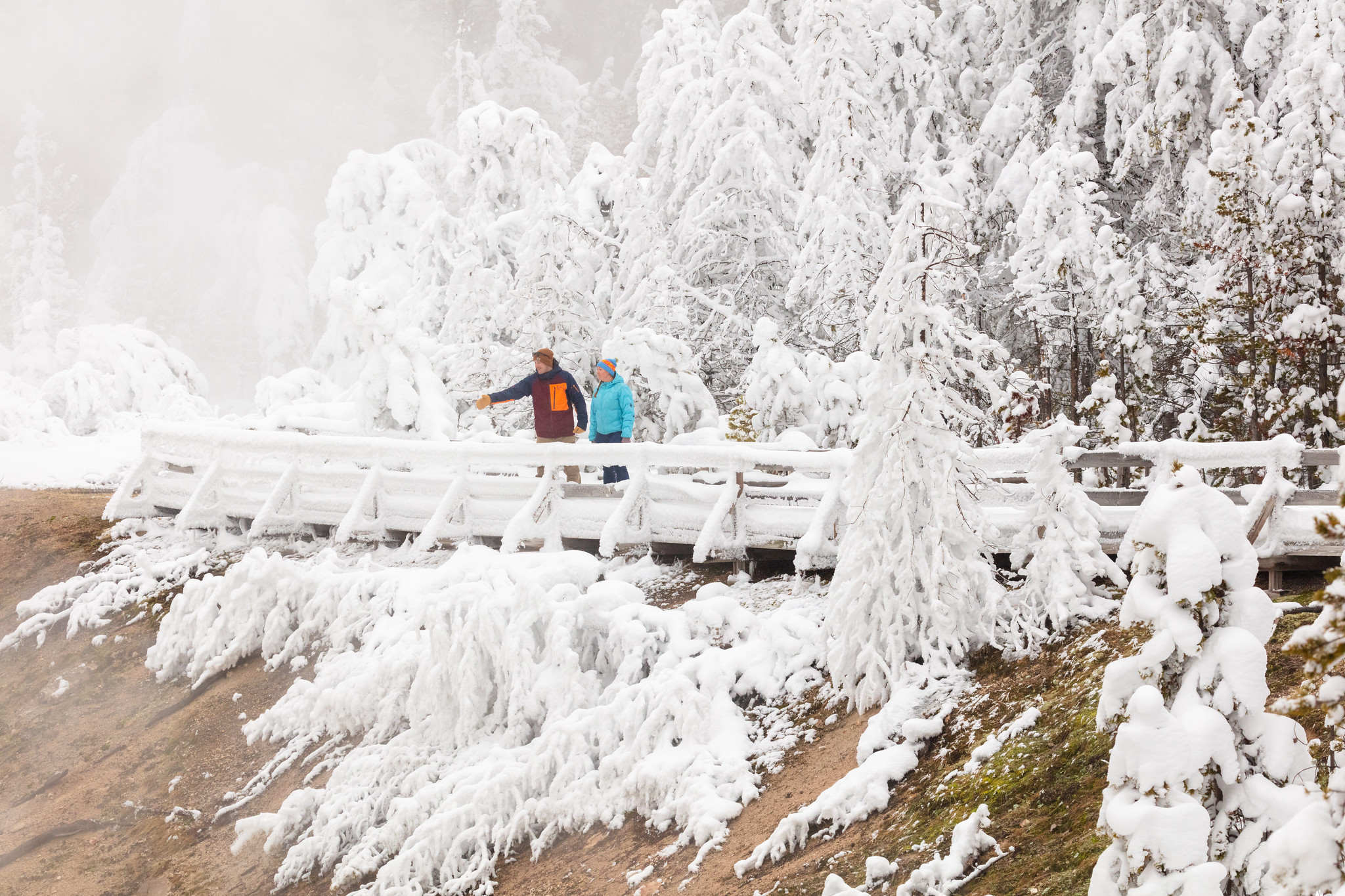 Enjoying views from a rime ice-covered boardwalk in Porcelain Ba ...